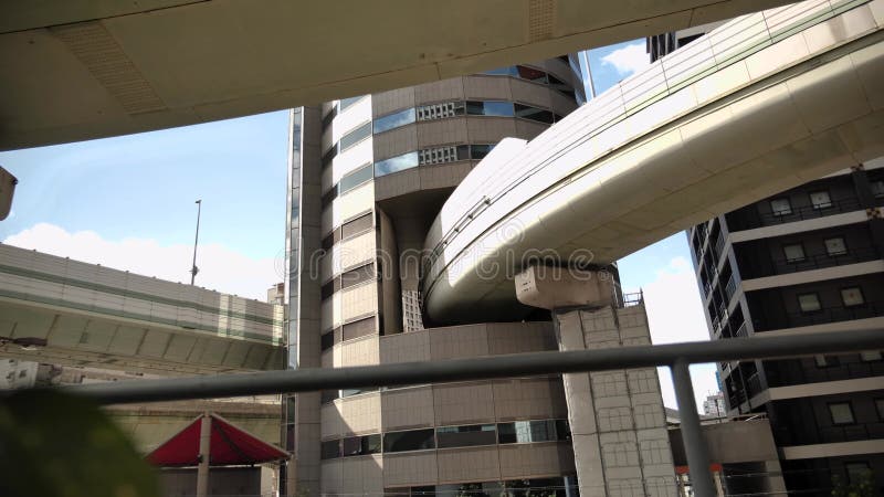 A Highway Passing through the TKP Gate Tower Building in Osaka, Japan ...