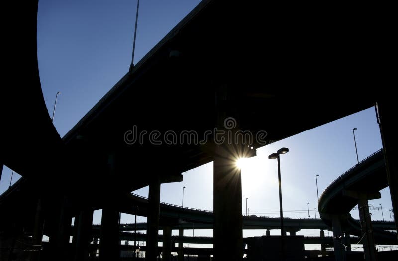 Highway Ramps in Silhouette with Sun Burst Stock Photo - Image of ...