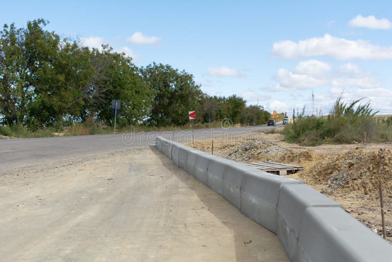 Highway Road Curb. Blocks in the Base of the Road, Building a Ring ...