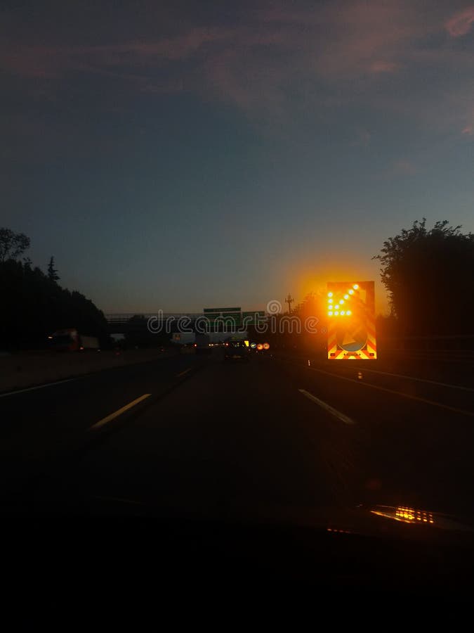 Highway sign at dawn stock photo. Image of night, sunset - 255402034