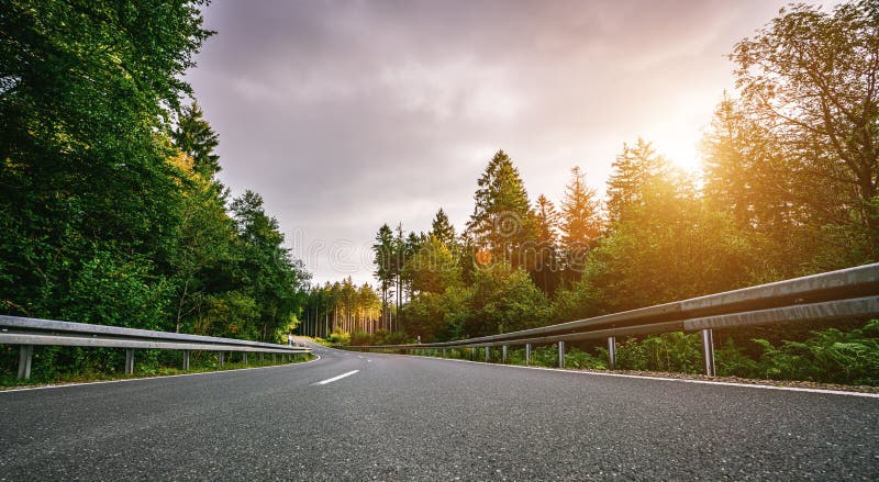 Highway into Silent Forest in Spring with Beautiful Bright Sun Rays ...