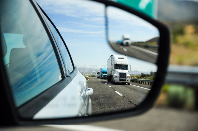 Highway Traffic Reflected in Side Mirror Against Scenic Desert ...