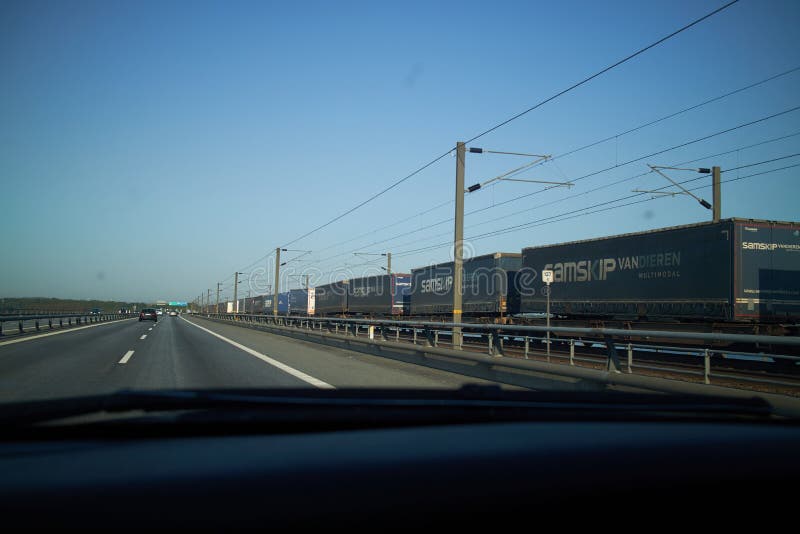 Highway and Train Tracks with Long Train Stock Photo - Image of supply ...