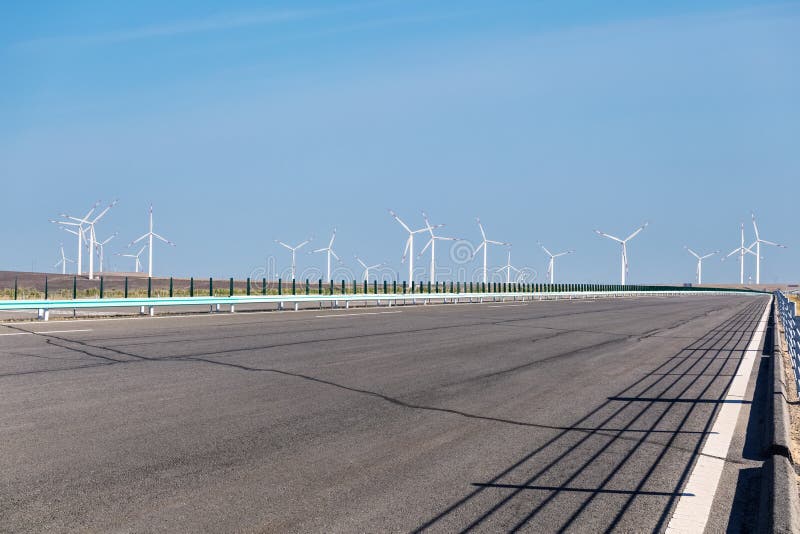 Highway with wind turbines stock photo. Image of roadway - 26583726
