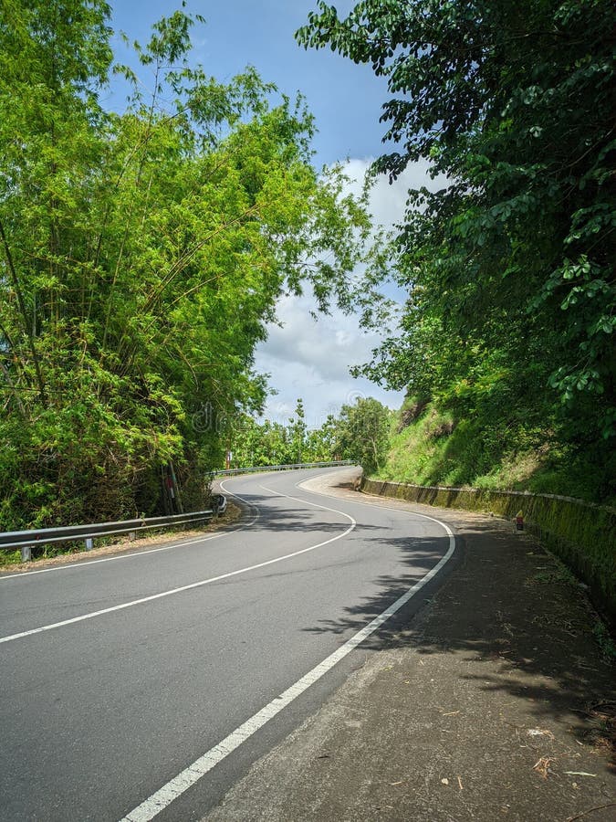 A Highway that Winds at the Foot of the Mountains. Stock Photo - Image ...