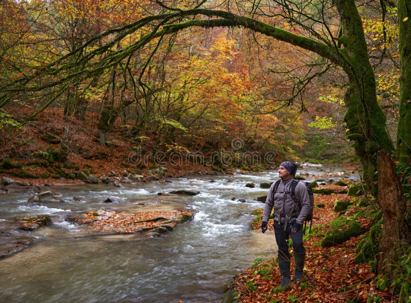 Hiker with Backpack by the River Stock Image - Image of outdoors ...