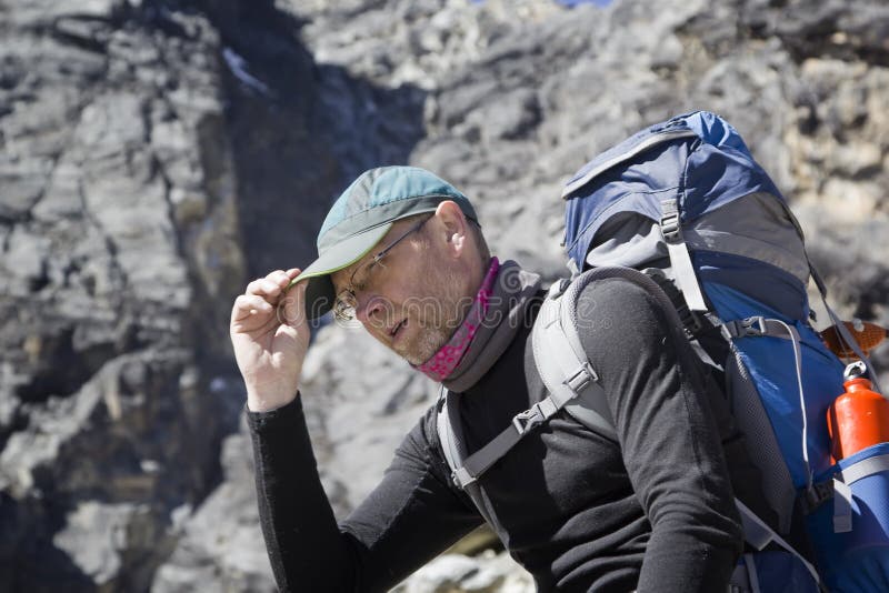 Hiker with Backpack Sitting and Resting Stock Photo - Image of ...