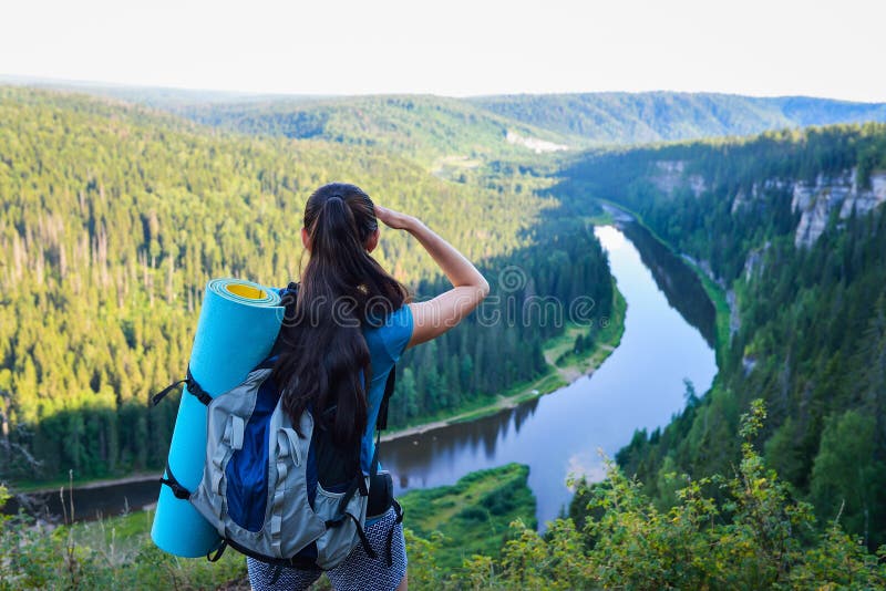 Hiker with Backpack Standing on a Rock and Looking To Somewhere Far Away Stock Photo - Image of ...