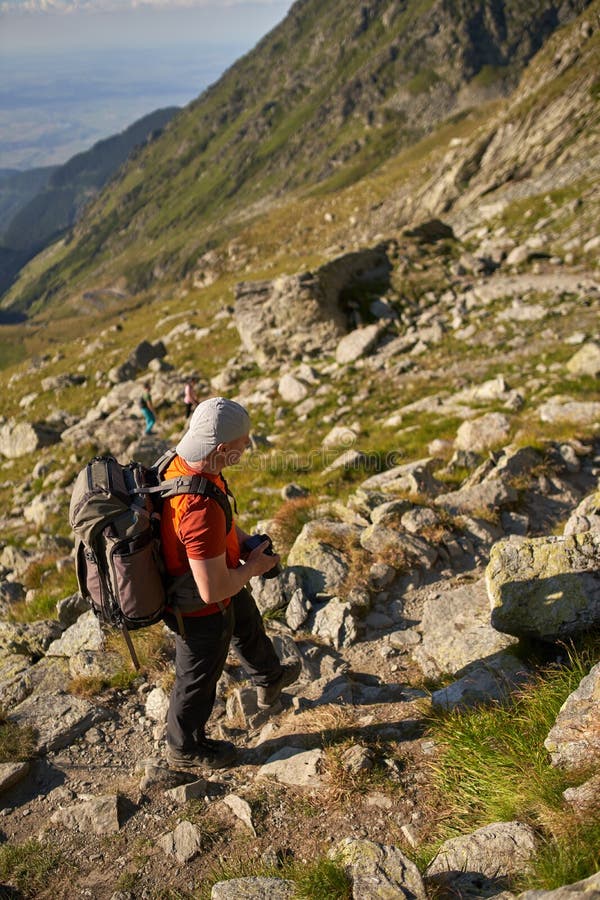 Hiker with Backpack on the Trail Stock Image - Image of adult, natural ...