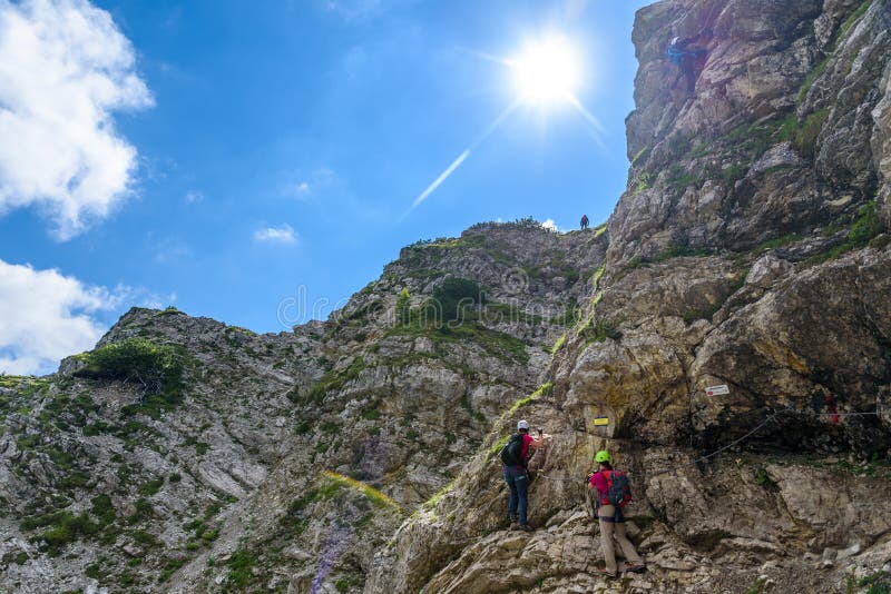 Hiker Climbing in the Mountain of Alps, Europe Stock Photo - Image of ...