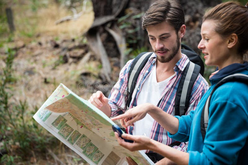 Hiker Couple Looking at Map Stock Photo - Image of adventure ...