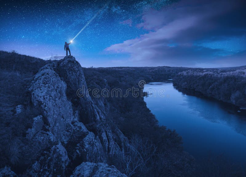Hiker with Flashlight Under the Starry Night Sky Stock Image - Image of ...