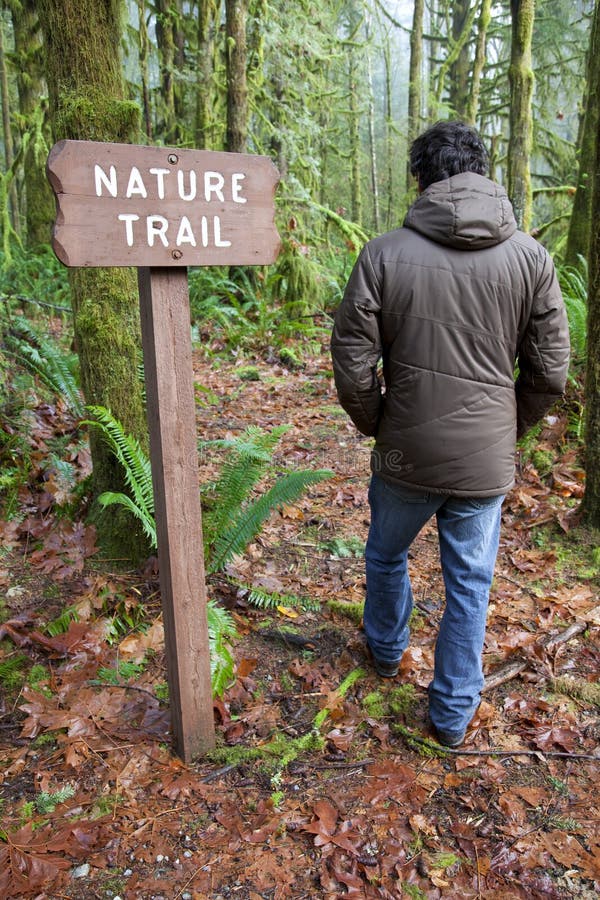 Hiker following a sign stock image. Image of leisure - 12723289