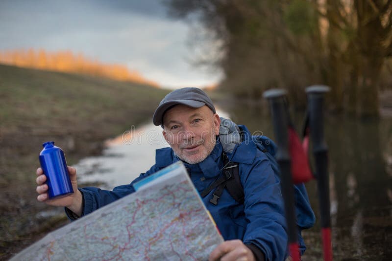 Hiker Looking at Map in Forest Stock Image - Image of active, hike ...