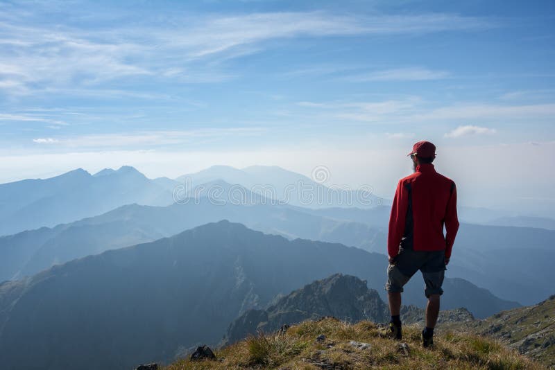 Hiker Looking Over the Mountain Ridges Stock Image - Image of ridges ...