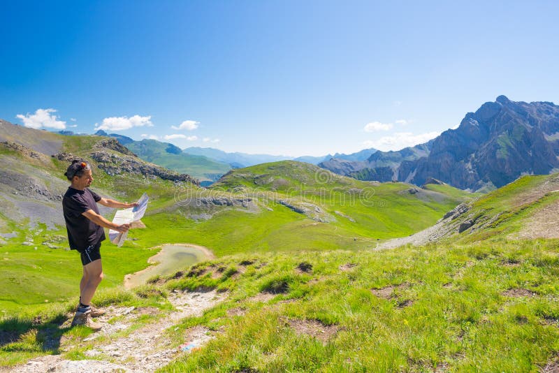 Hiker Reading Trekking Map while Resting at Panoramic Mountain Spot ...