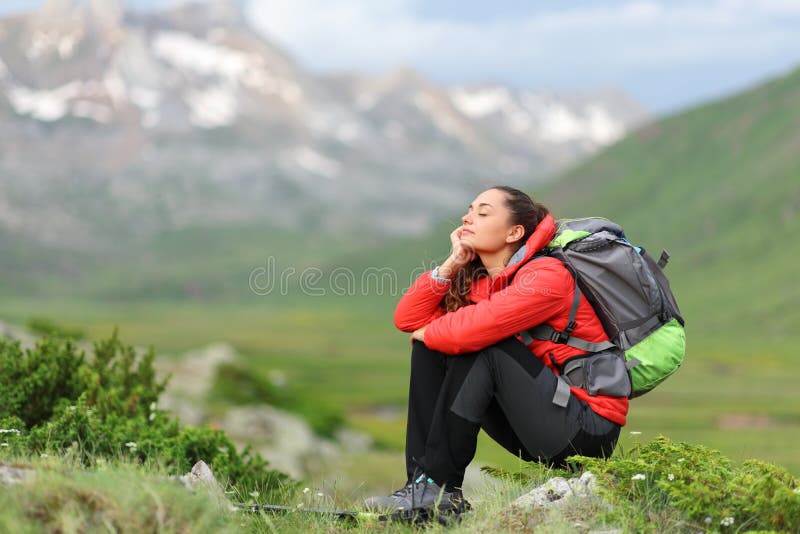 Hiker Relaxing Sitting on a Rock in a High Mountain Stock Image - Image ...