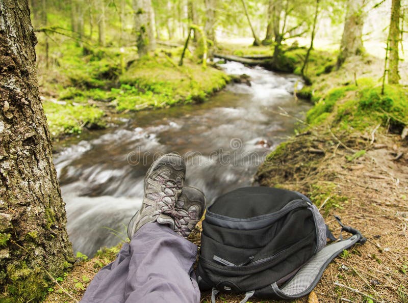 Hiker Resting in the Forest Next To River Stock Image - Image of nature ...
