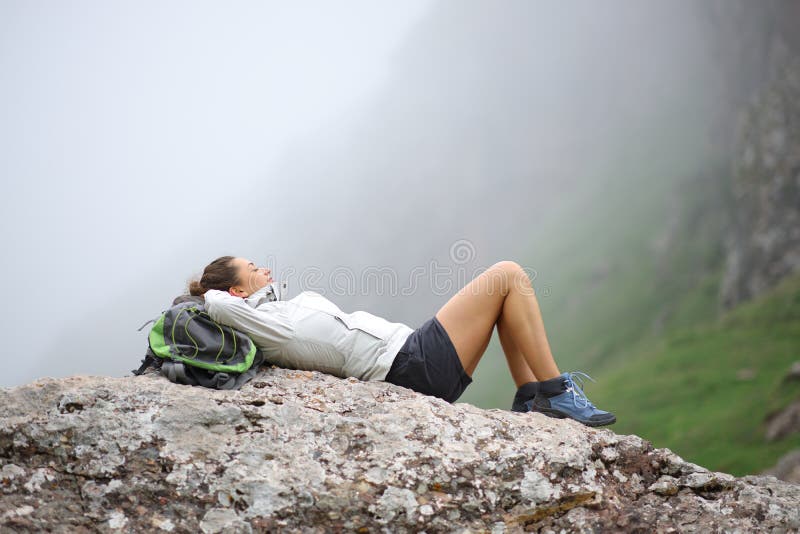 Hiker Resting on a Rock in the Mountain Stock Image - Image of health ...