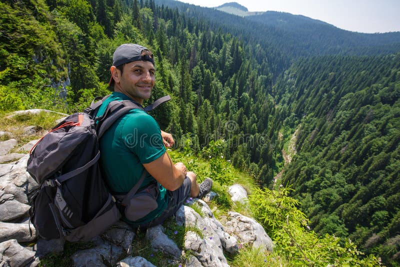 Hiker Resting on a Very High Cliff Stock Image - Image of deep ...