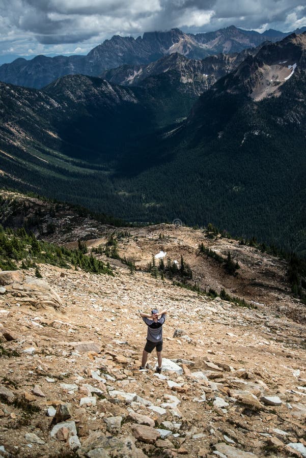 Hiker on rocky hillside stock photo. Image of trek, cloudy - 83075348
