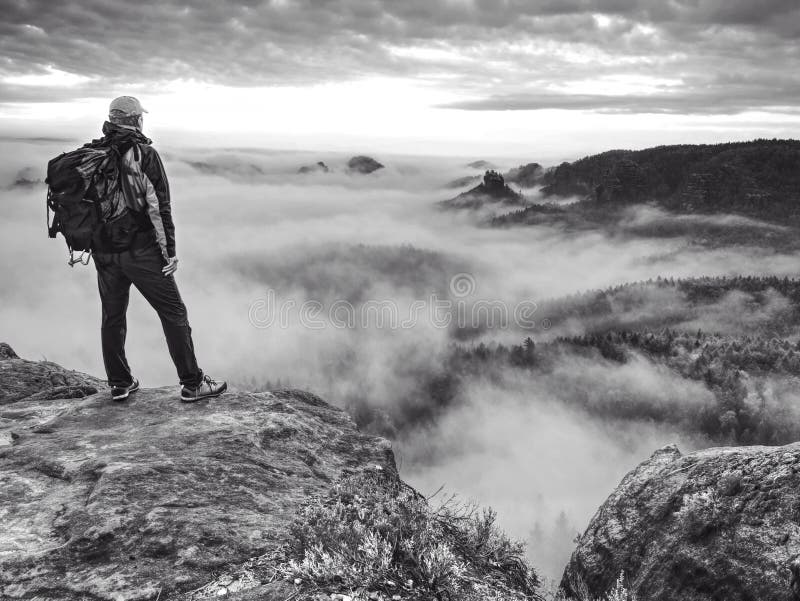 Man Hiker on Sharp Cliff. Hiker Climbed Up To Peak Enjoy View. Man ...
