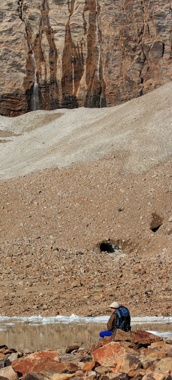 Hiker Sitting at Cavell Pond Stock Photo - Image of national, cave ...