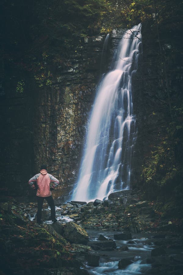 Hiker Standing in Front of the Waterfall. Instagram Stylization Stock ...