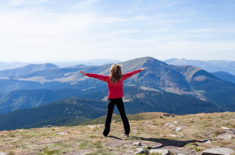 Hiker Standing on a Peak Over the Mountain with Raised Hands Stock ...