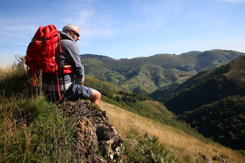 Hiker Taking a Break after Walking in the Mountains Stock Photo - Image ...