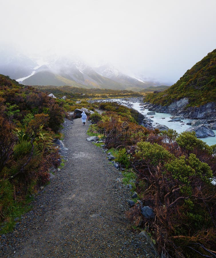 A Hiker Tramping on Valley Track during Raining. Stock Image - Image of ...