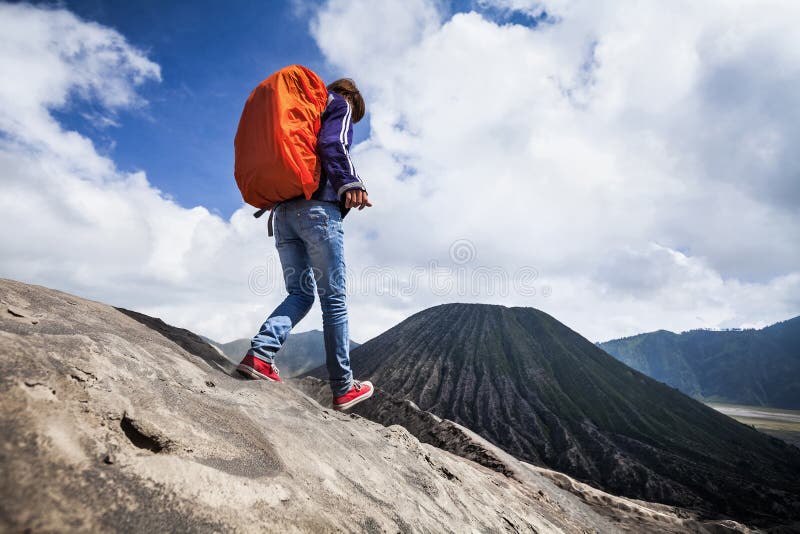 Hiker and volcano stock image. Image of body, countryside - 76659489