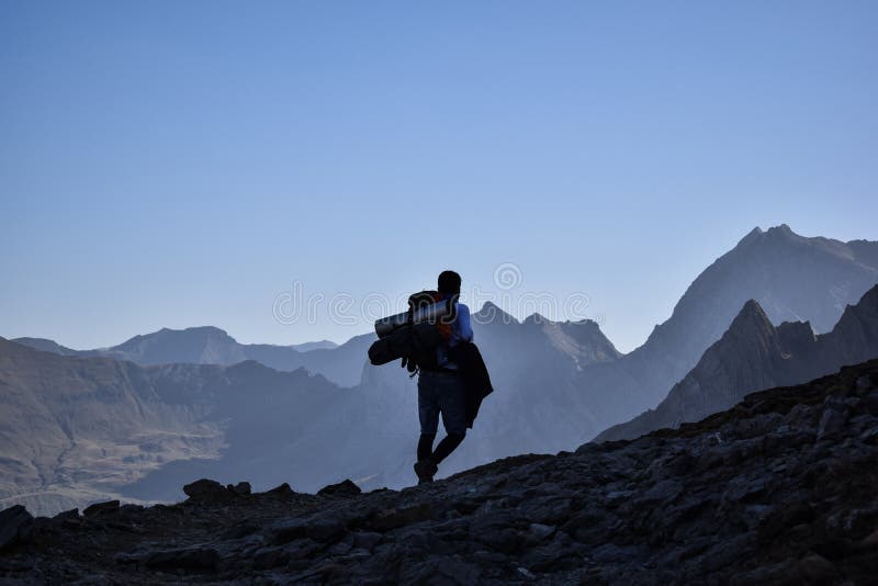 Hiker Walking on the Ridge of a Mountain Stock Photo - Image of amazing ...