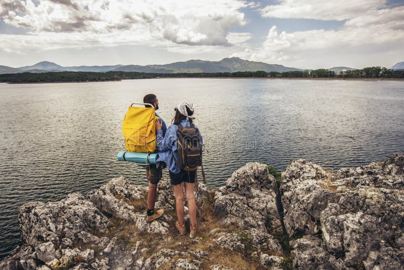 Hikers with Backpacks Walking Enjoying at the Mountain Lake Stock Image ...
