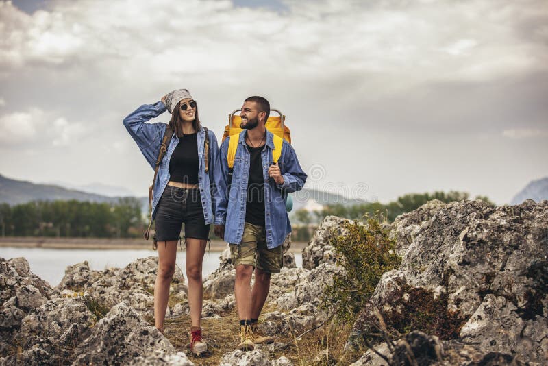 Hikers with Backpacks Walking Enjoying at the Mountain Lake Stock Image ...