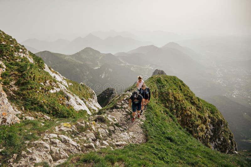 The Hikers are Descending the Steep Hill, on the Trail Editorial Stock ...