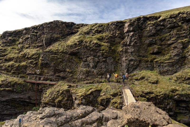 Hikers Exploring Beautiful Icelandic Landscape. Crossing Simple Bridge ...