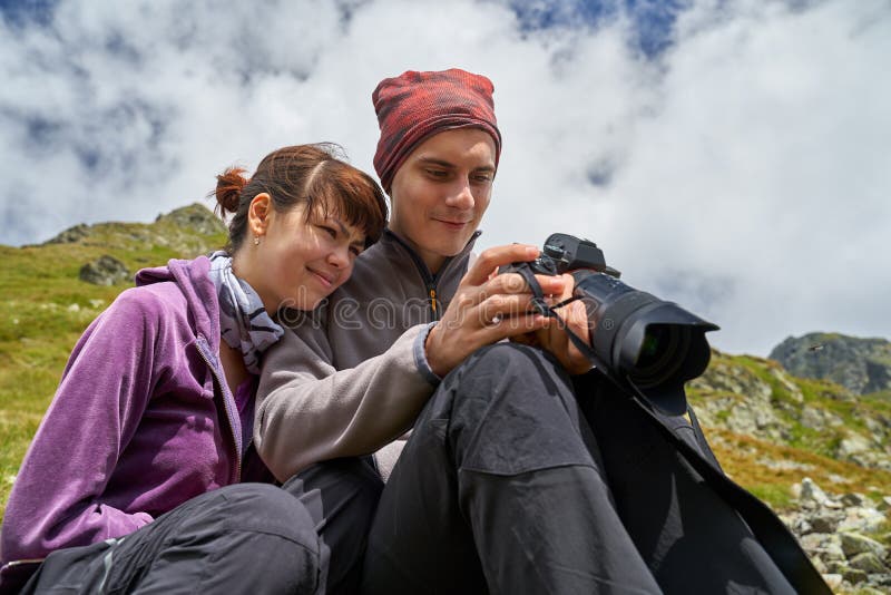 Hikers Looking at Their Photos on Camera Stock Photo - Image of outdoor ...