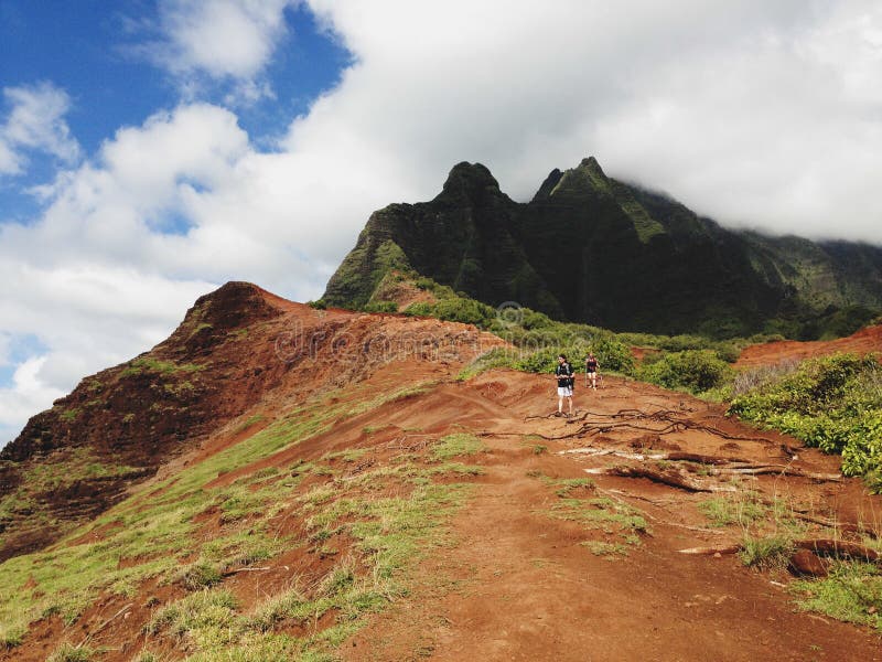 Hikers on red hills stock photo. Image of travelers, ridge - 83013078