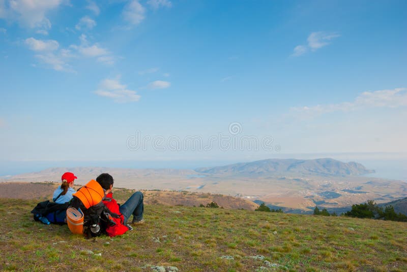 Hikers sit on the slope stock image. Image of extreme - 13808427