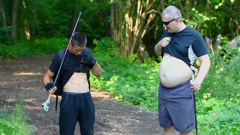 Hikers with Six Pack and Overweight in Forest Stock Footage - Video of ...