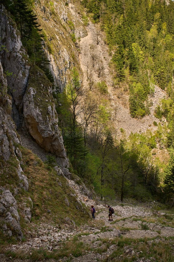 Hikers in Steep Rocky Ravine Stock Image - Image of ravine, rocks ...