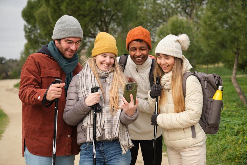 Hikers Using Smartphone and Smiling during Excursion in Nature Stock ...