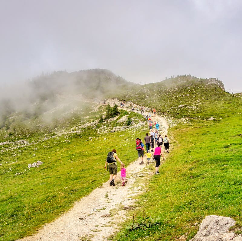 Hiking in the Alps editorial stock image. Image of foggy - 155165089