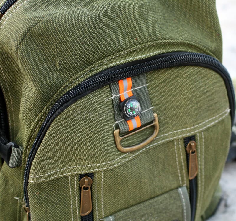Hiking Backpack Color Khaki with a Compass Behind. Stock Photo - Image ...