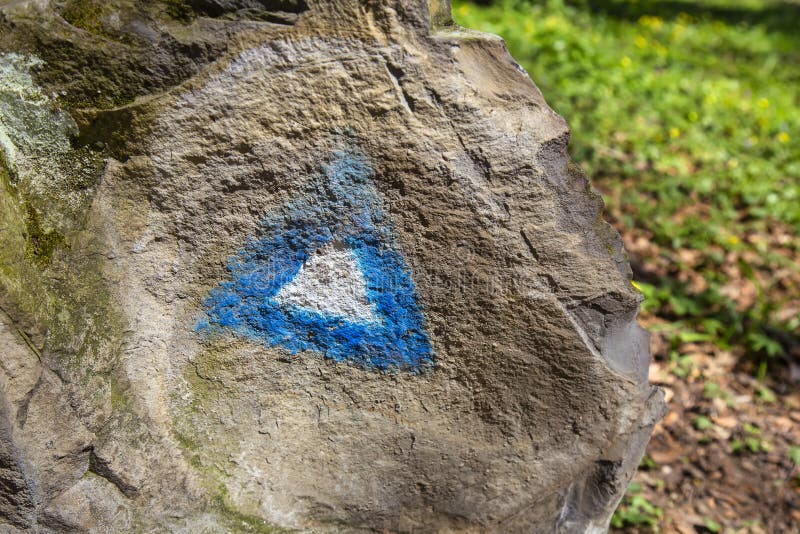 Hiking Blue Triangle Paint Marking on a Rock Stock Photo - Image of ...