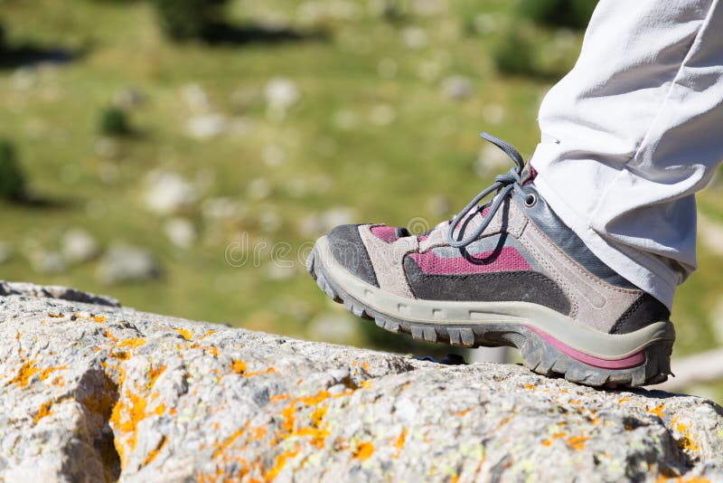 Hiking boot on a rock stock image. Image of equipment - 44380195