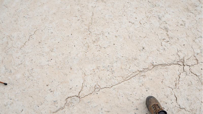 Hiking Boot and Walking Stick on Textured Sandstone Surface Stock ...