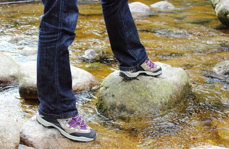 Hiking Boots and Legs of a Woman Over a Mountain Stream Stock Image ...