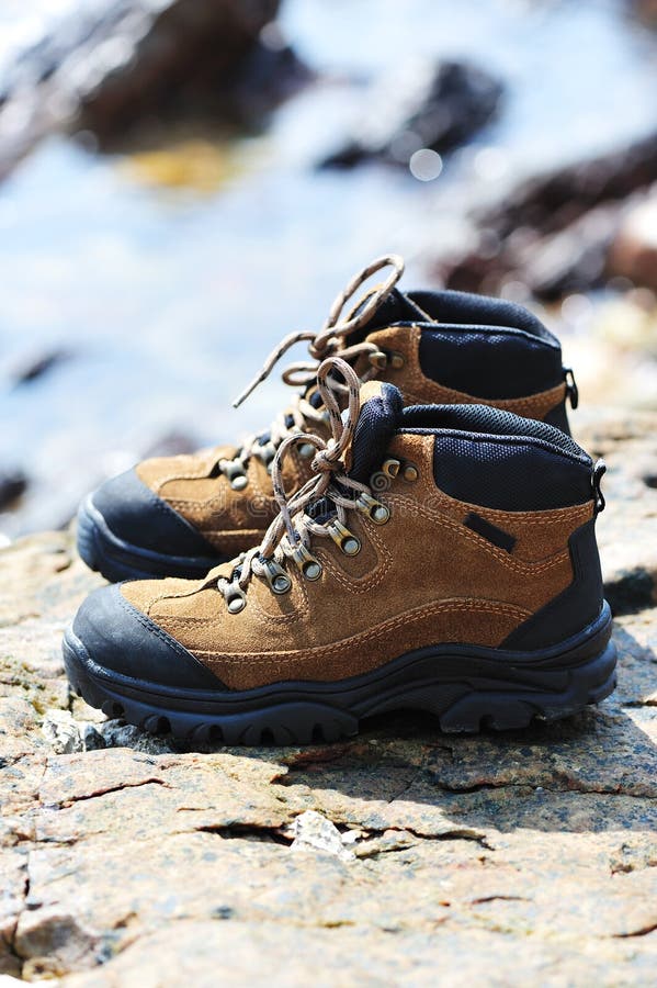 Hiking boots on rock stock photo. Image of sneakers, running - 27604200